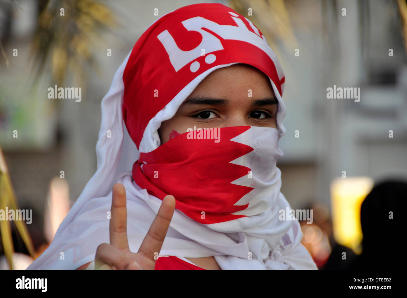 Barbar, Bahrain. 15th Feb, 2014. A woman gives a victory sign as she ...