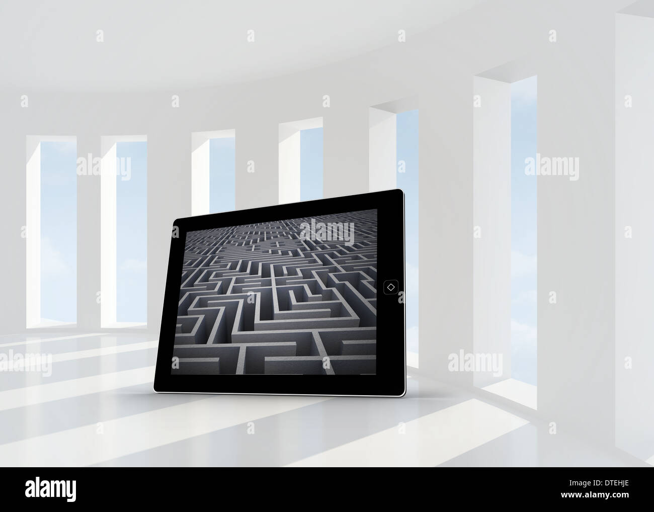 Composite image of maze on tablet screen Stock Photo - Alamy