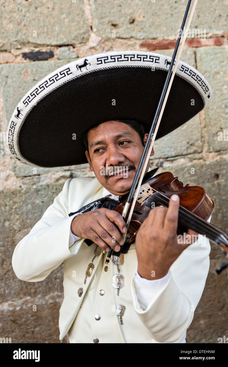 A mariachi band member dressed in traditional charro costume November 5 ...