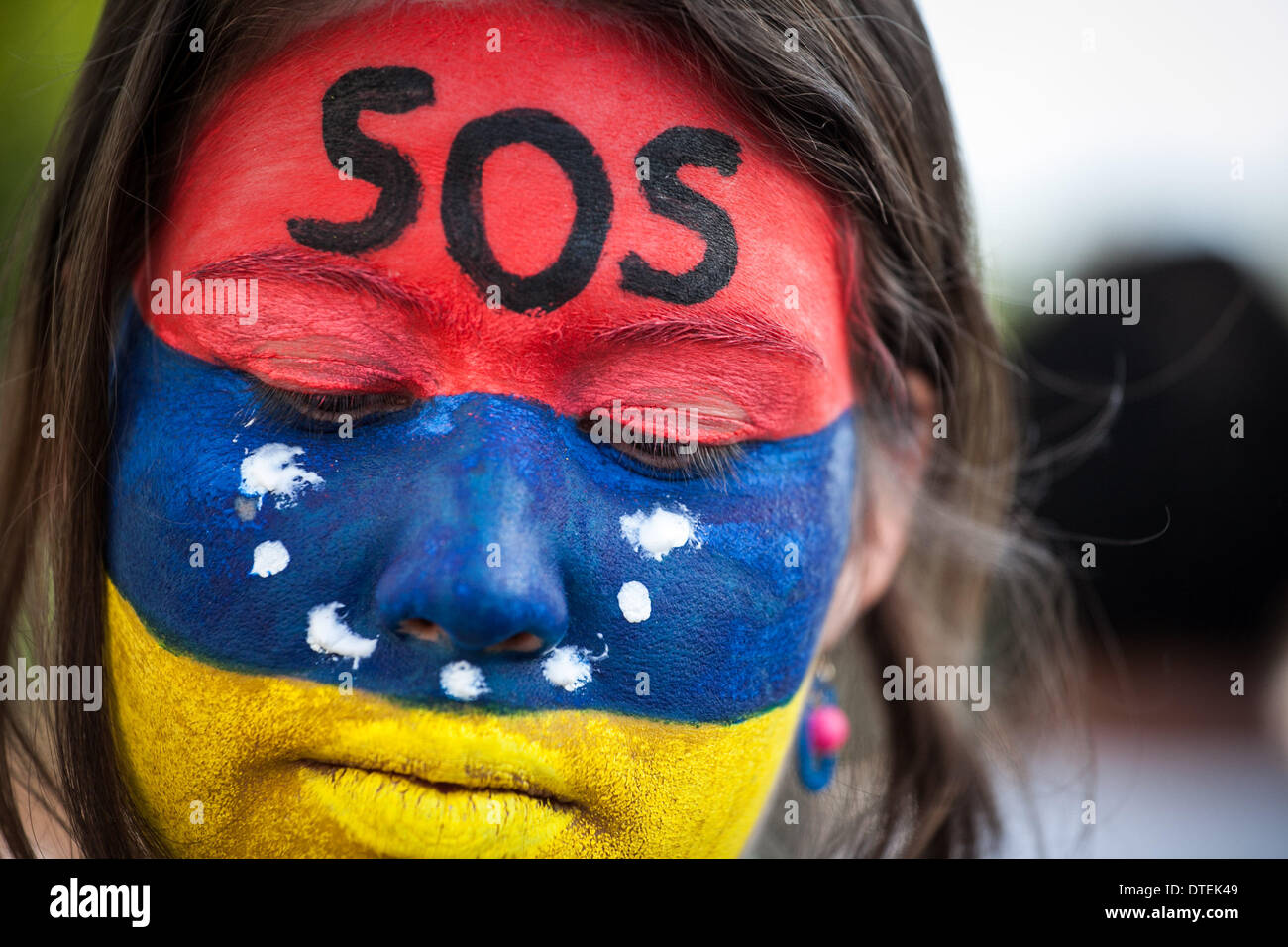 Caracas, Venezuela. 16th Feb, 2014. A demonstrator with the face ...