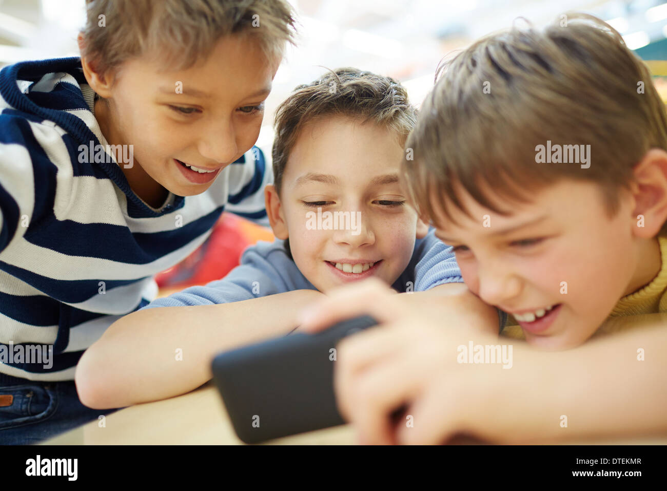 Boys using new smartphone hi-res stock photography and images - Alamy
