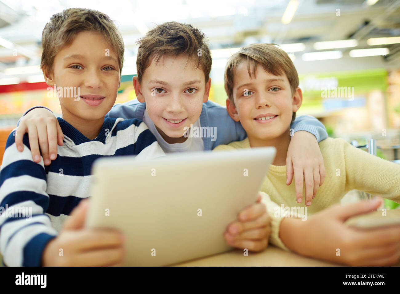 Happy boy sitting in cafe hi-res stock photography and images - Alamy