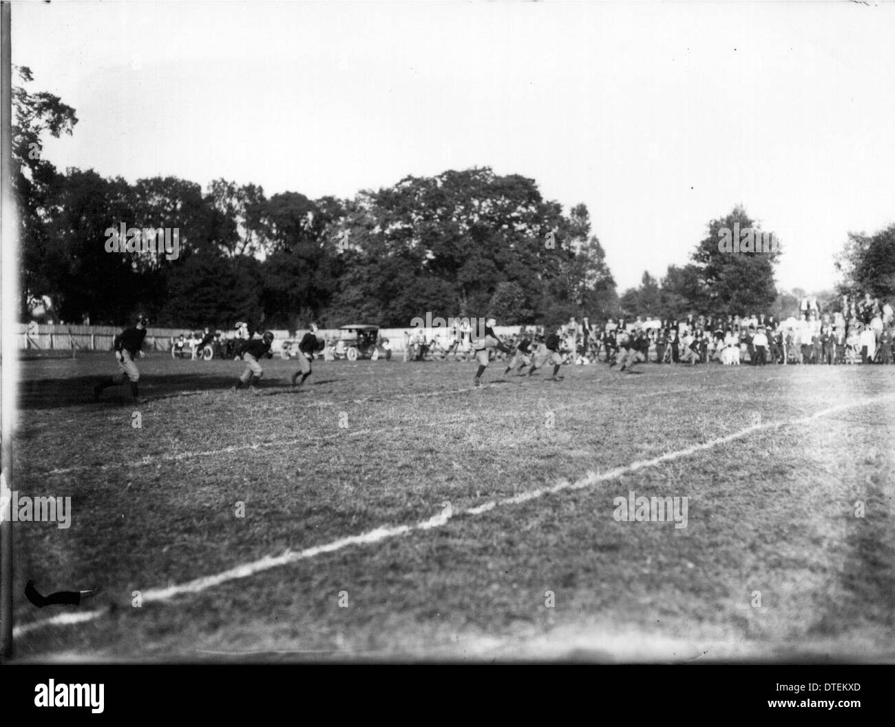This photograph captures the action during a 1913 football game between ...