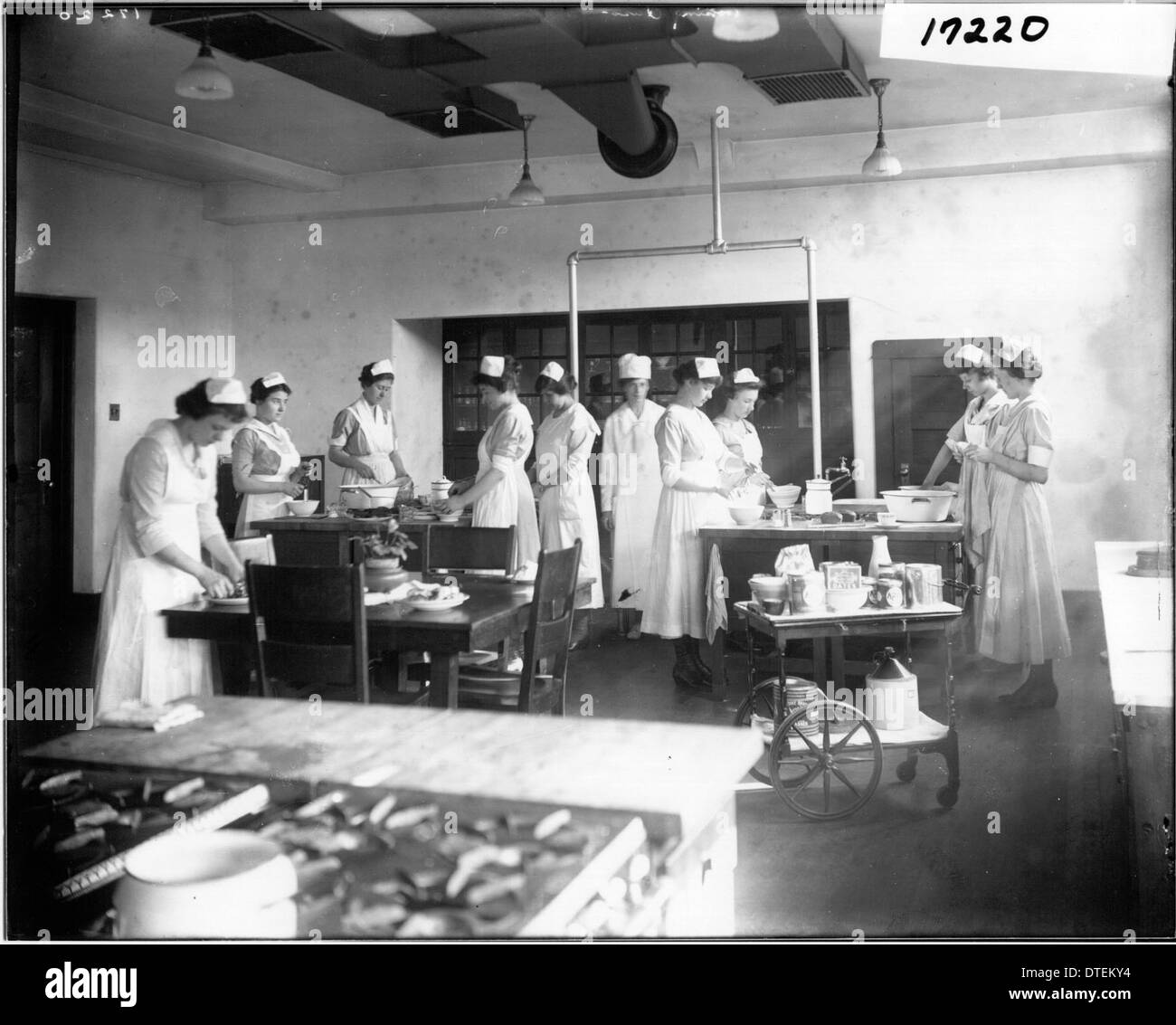 A photograph from 1918 showing students in a cooking laboratory at ...