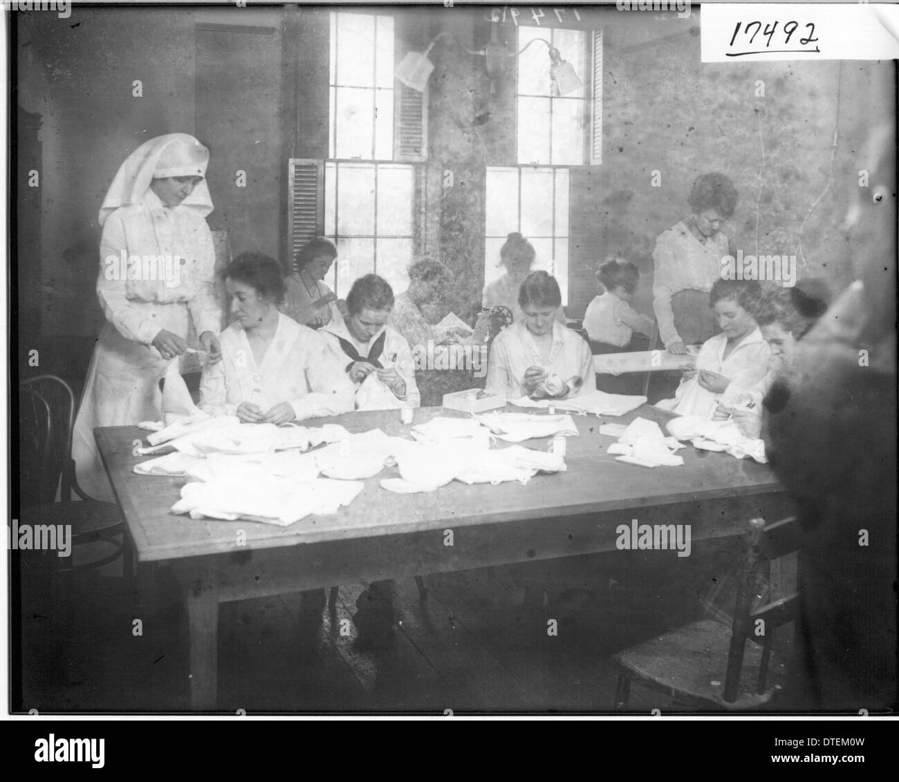 Home economics class sewing Black and White Stock Photos & Images - Alamy