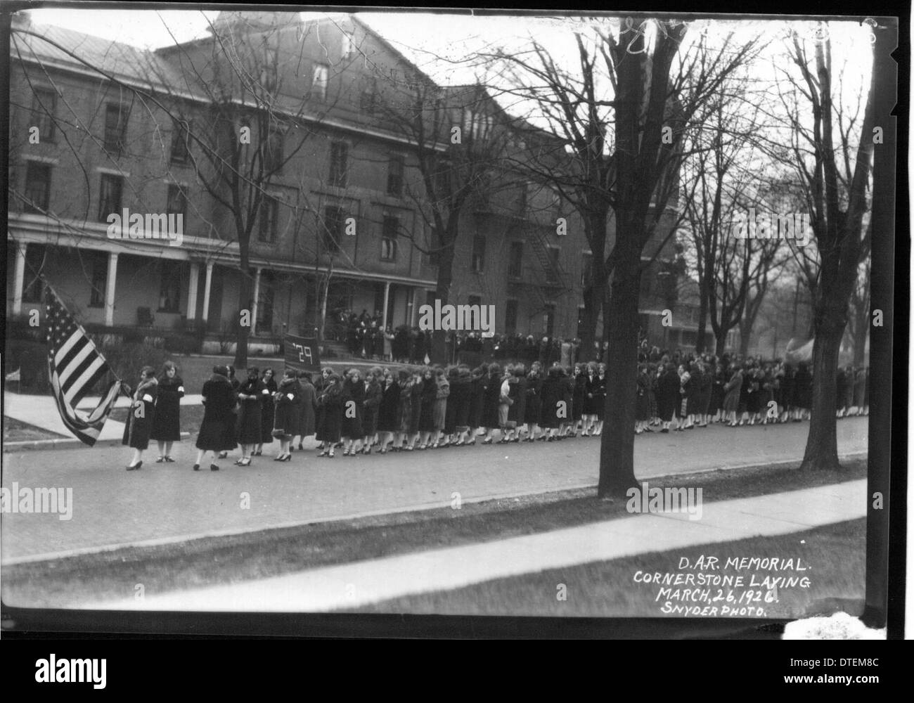 This 1926 photograph captures a procession in front of Oxford College ...