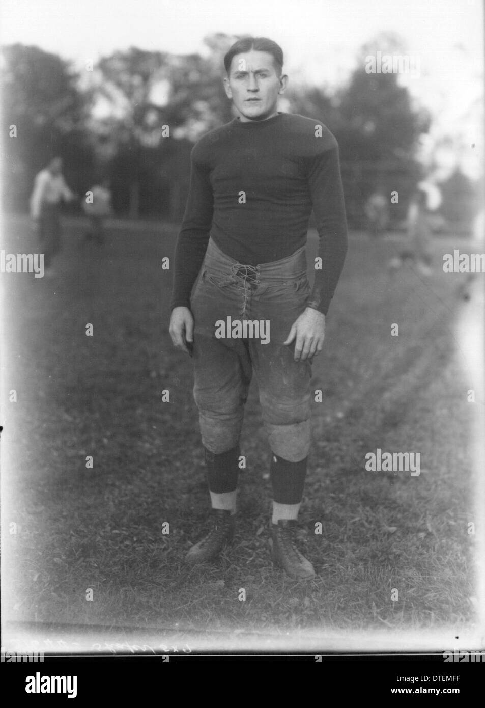 A portrait of Carelton Shafer, captured in 1922, wearing a football ...
