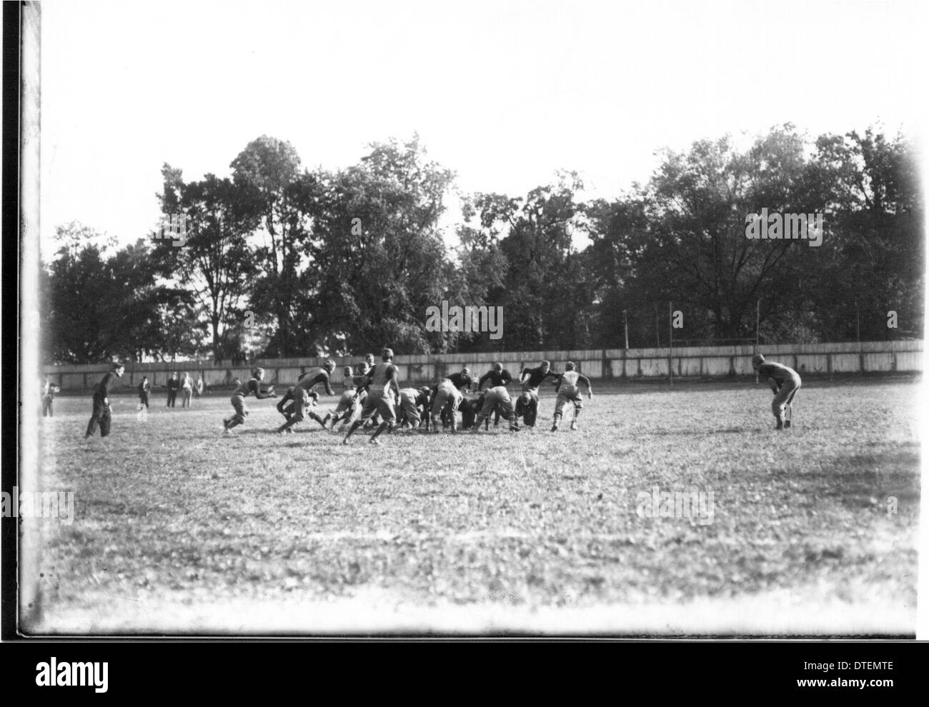 This 1910 photograph shows the action during a Miami-Wilmington ...