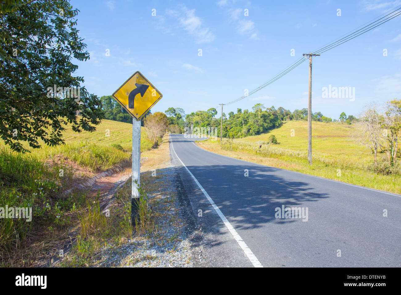 curve signage, empty street with yellow curve signage Stock Photo - Alamy