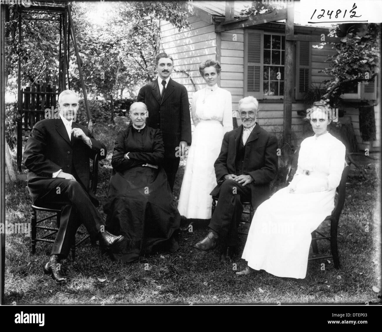 A portrait of the Alfred Garrod family in 1913, standing in front of ...