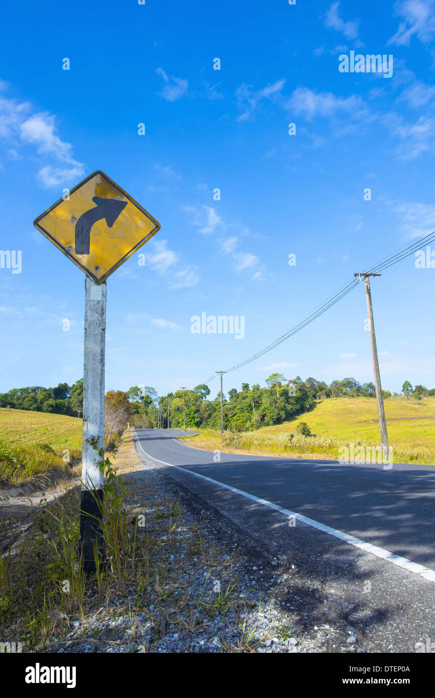 curve signage, empty street with yellow curve signage Stock Photo - Alamy