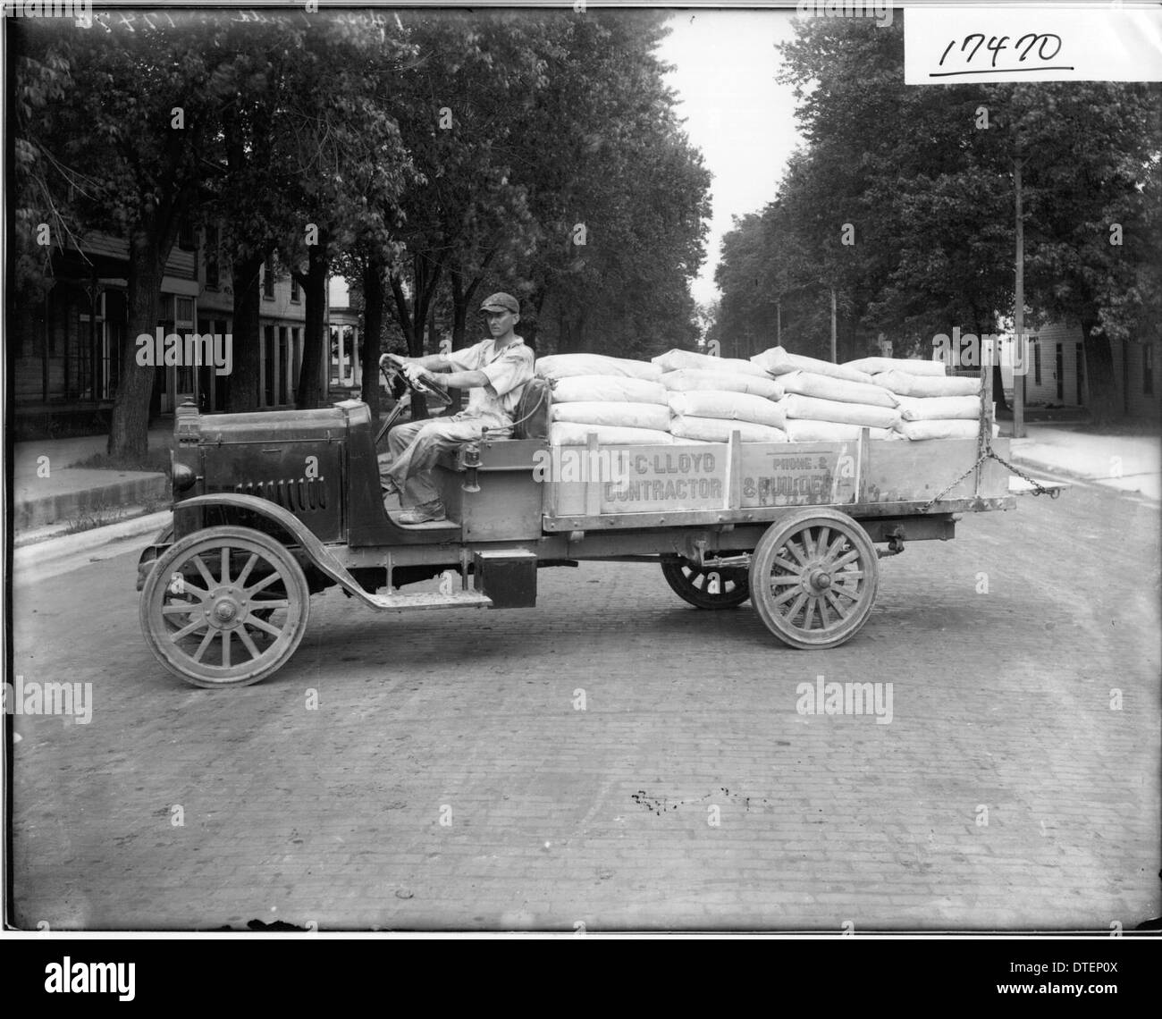 This photograph from 1918 shows Lewis Roll driving a truck owned by T.C ...
