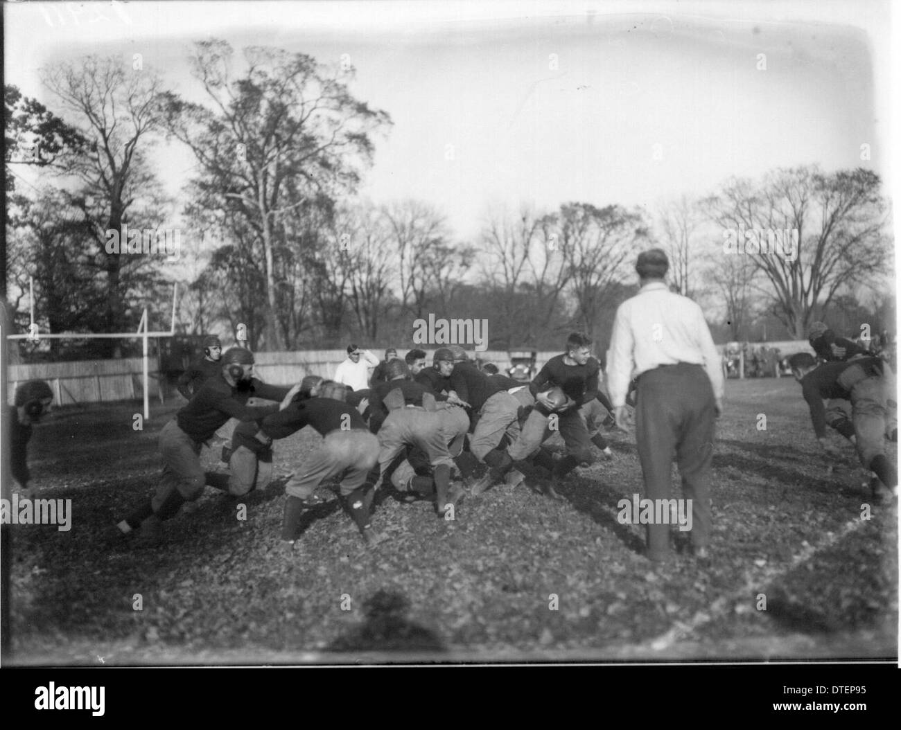 This 1913 photograph captures a critical moment during the goal line ...