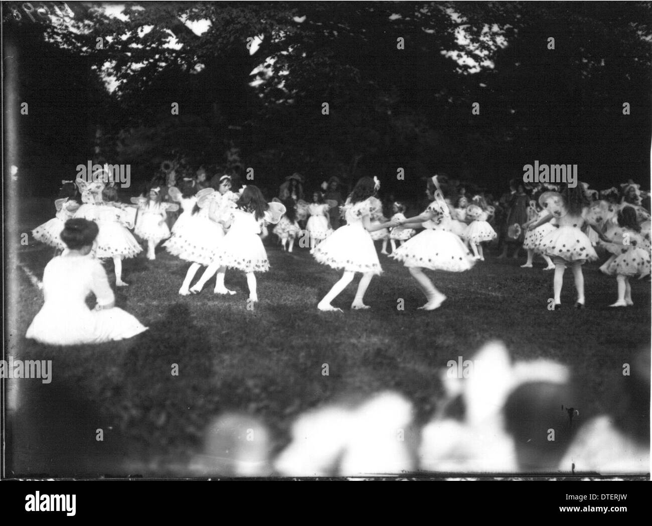 This 1912 photograph depicts a May Day performance at McGuffey School ...