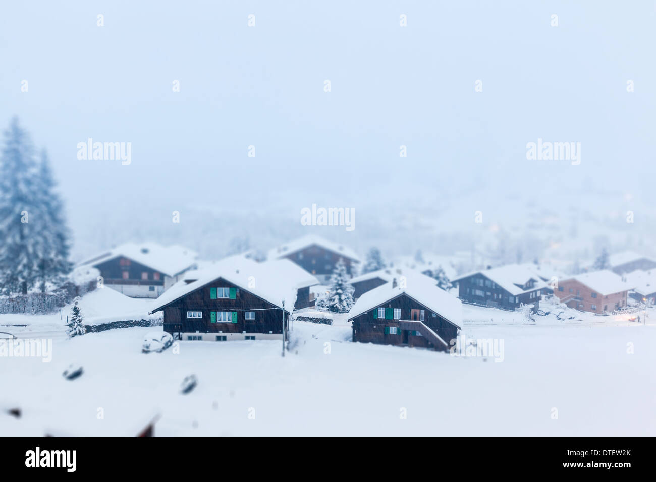 Traditional wooden houses in Grindelwald, Switzerland during heavy snow ...