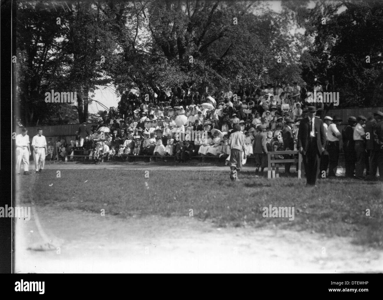 This photograph from 1912 captures spectators watching a high school ...