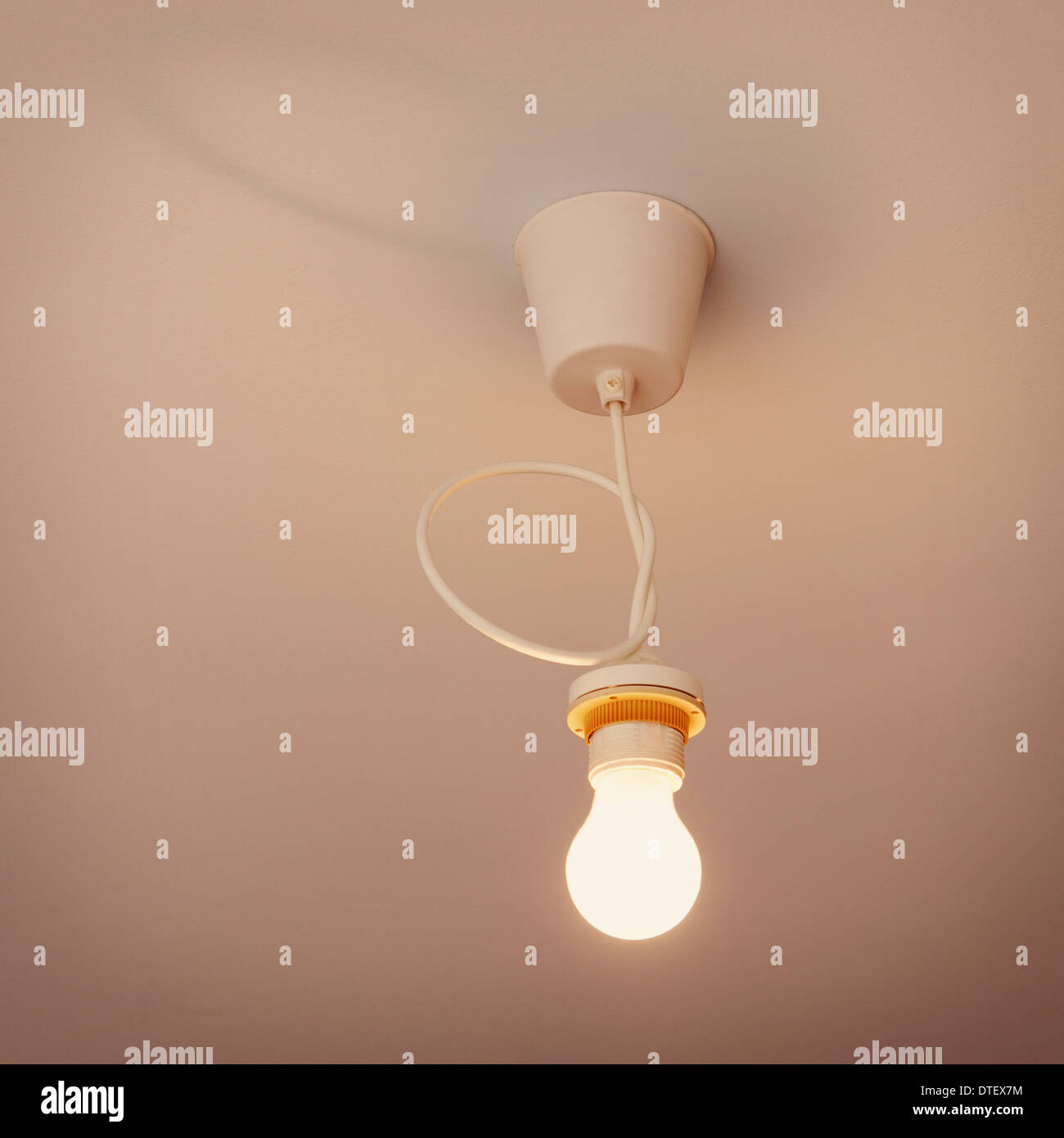 warm light bulb illumination on the ceiling Stock Photo - Alamy