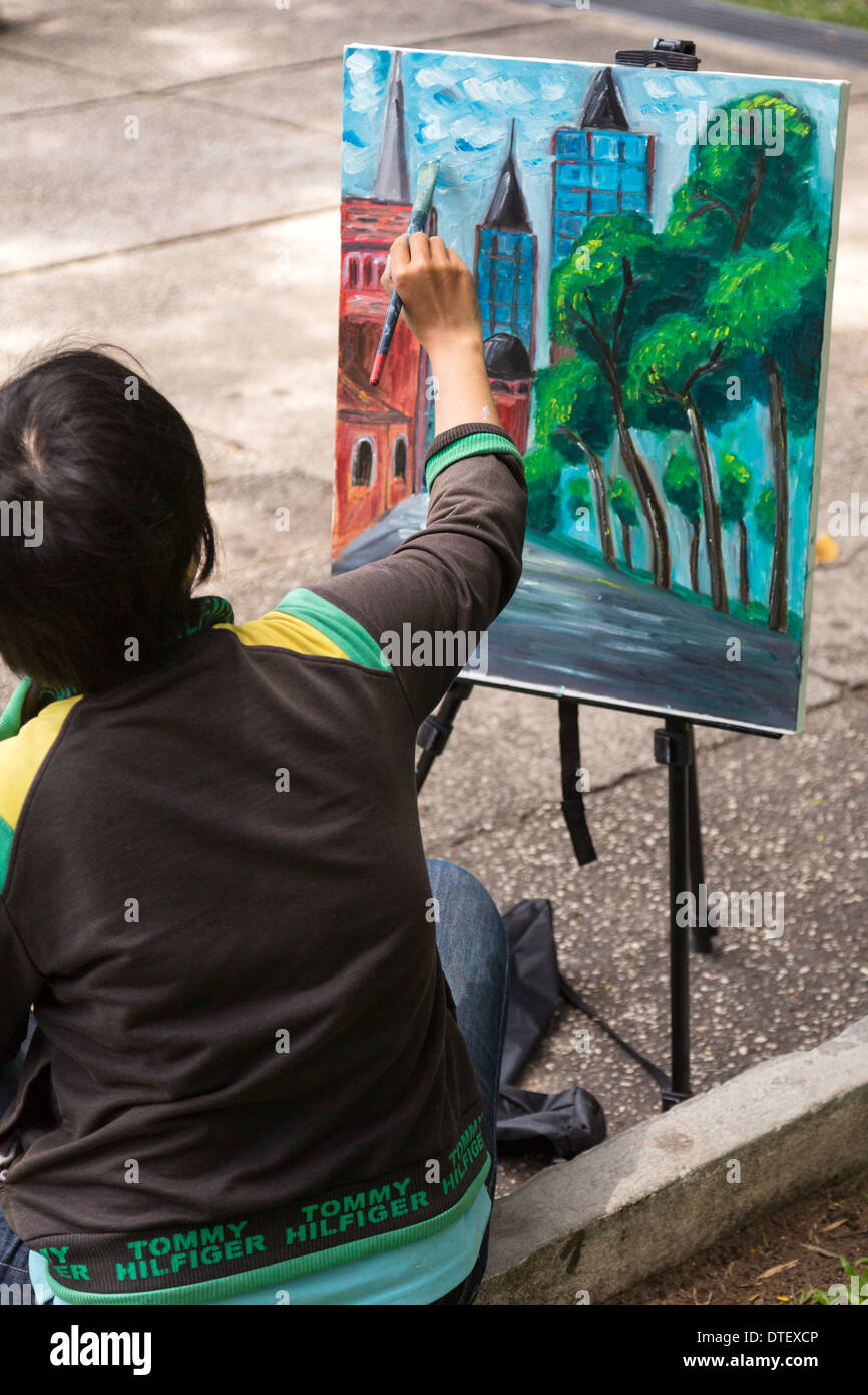 Artist painting cityscape, Saigon, Vietnam Stock Photo - Alamy