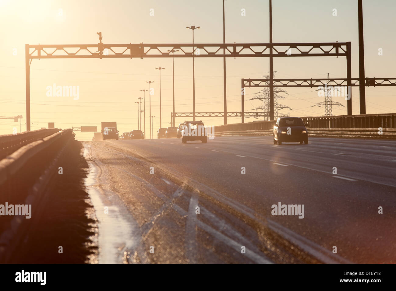 City ring road at sunset with silhouettes of driving vehicles Stock ...
