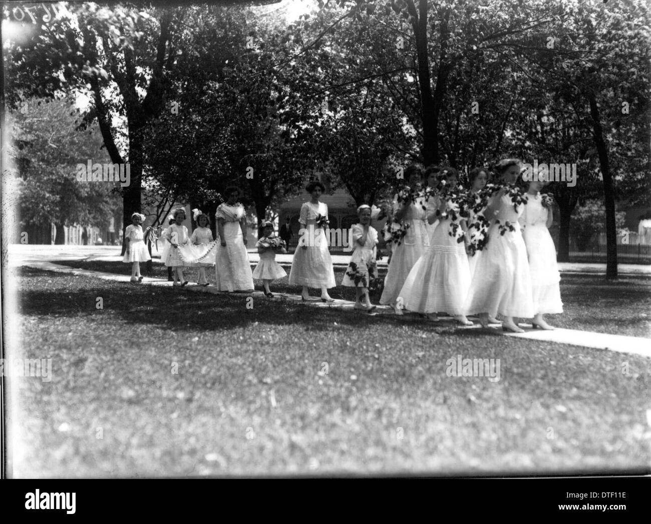 This photograph captures a procession at the Oxford College May Day ...