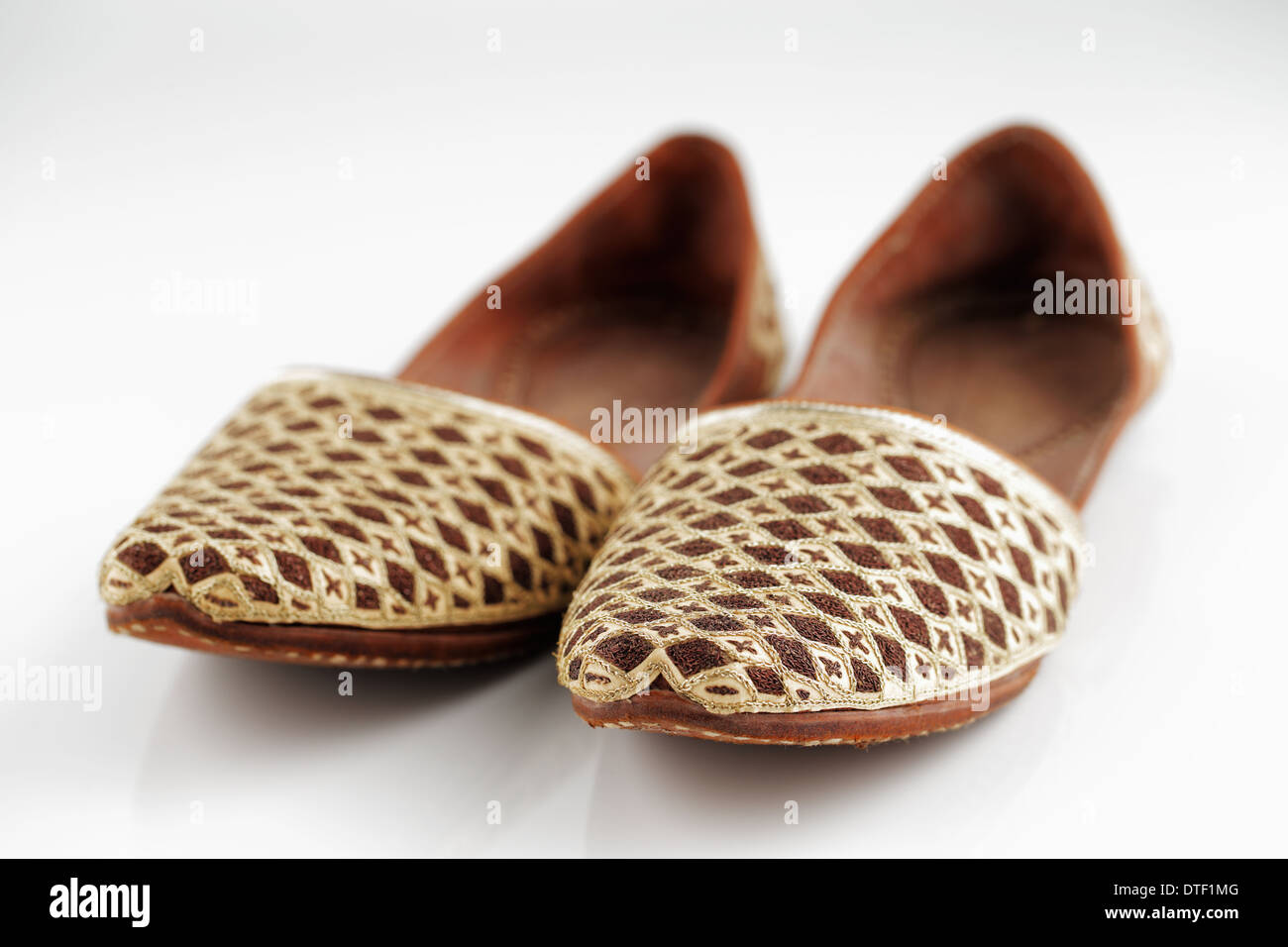 Traditional Arabic slippers shot against a white background Stock Photo ...