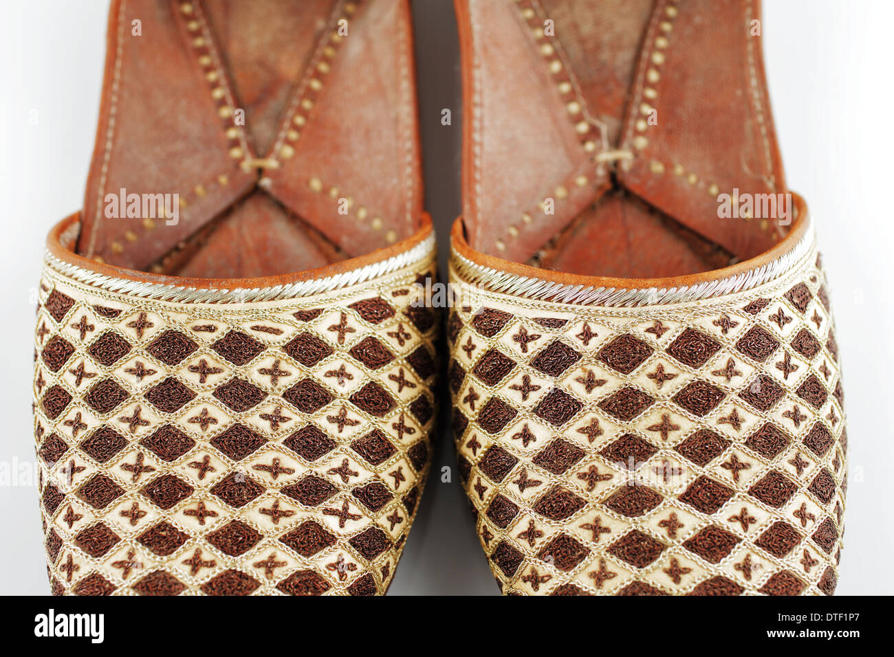Traditional Arabic slippers shot against a white background Stock Photo ...