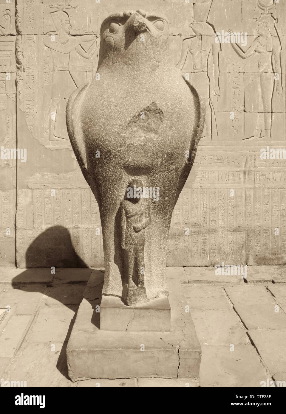ancient stone sculpture in front of a wall in Egypt showing Horus Stock ...