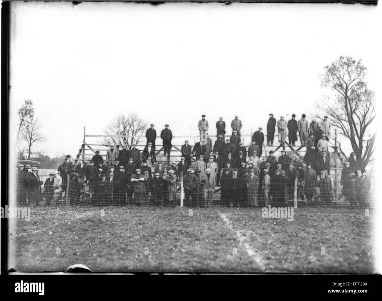 This image captures spectators in the stands at the 1910 football game ...