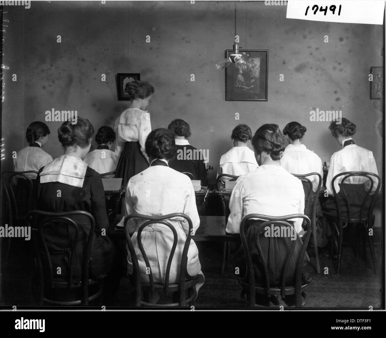 This photograph from 1918 depicts students in a typing class at Western ...