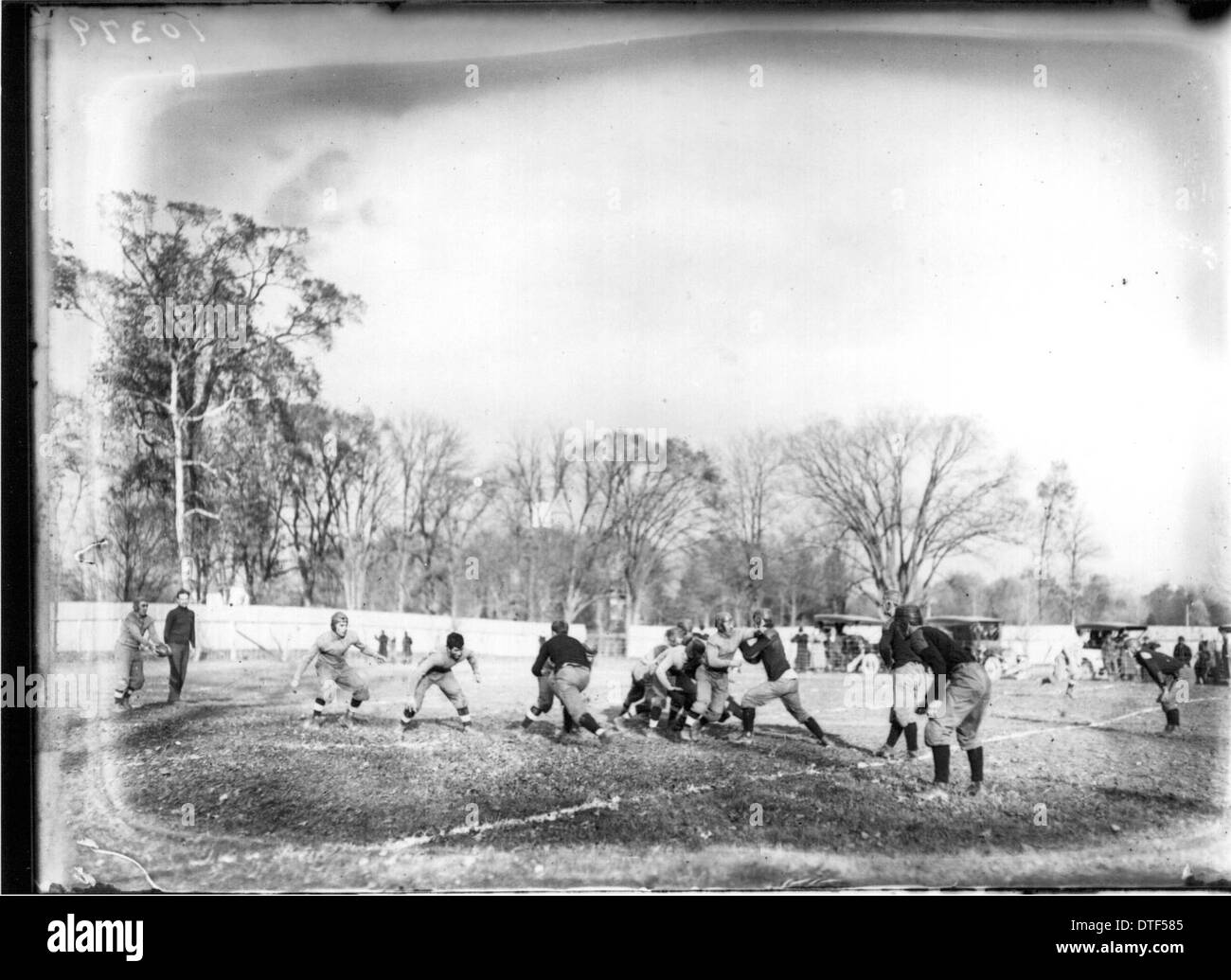 A photograph capturing a moment during the 1910 football game between ...