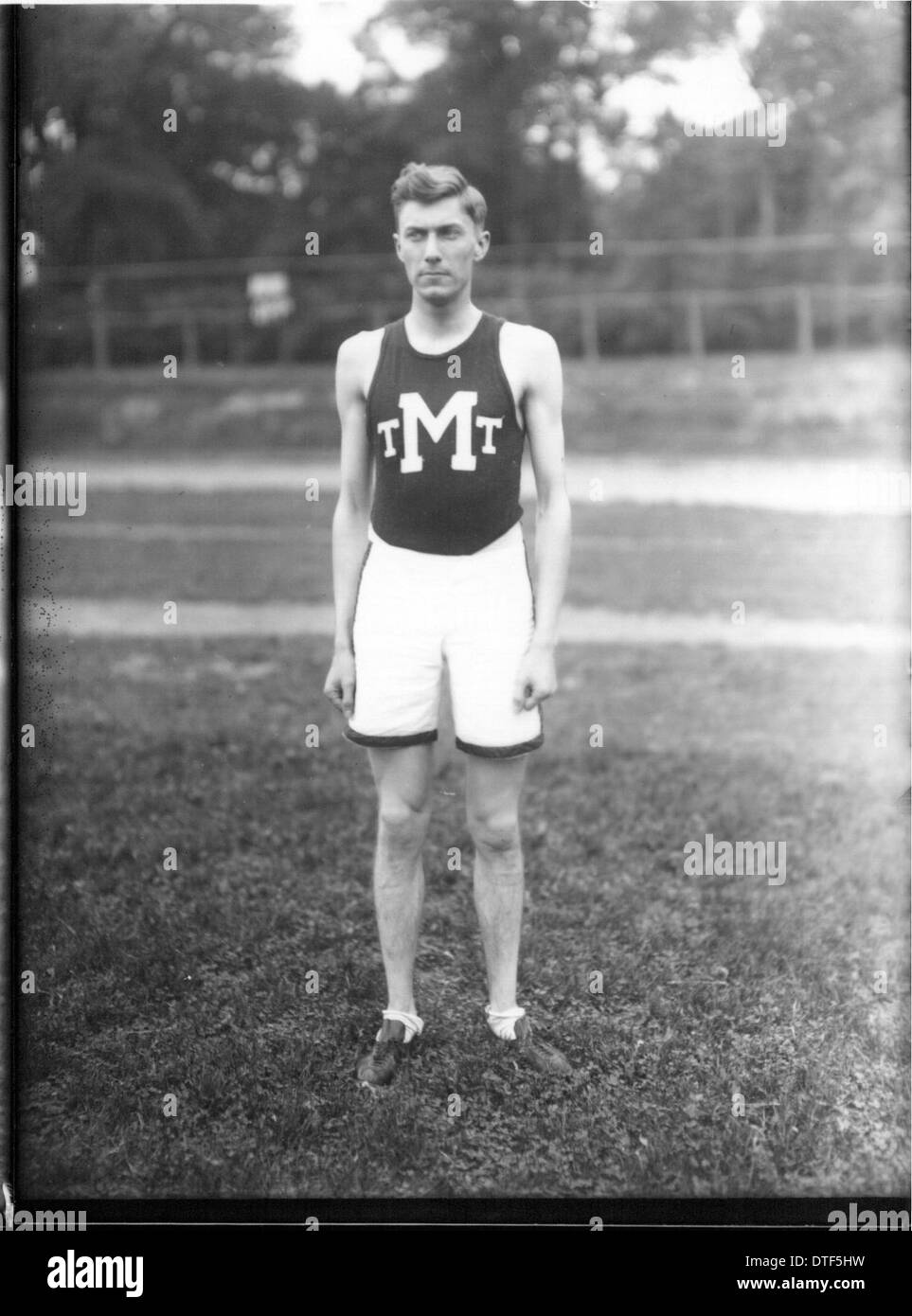 A 1922 portrait of Mark Schultz in a track uniform. The image captures ...