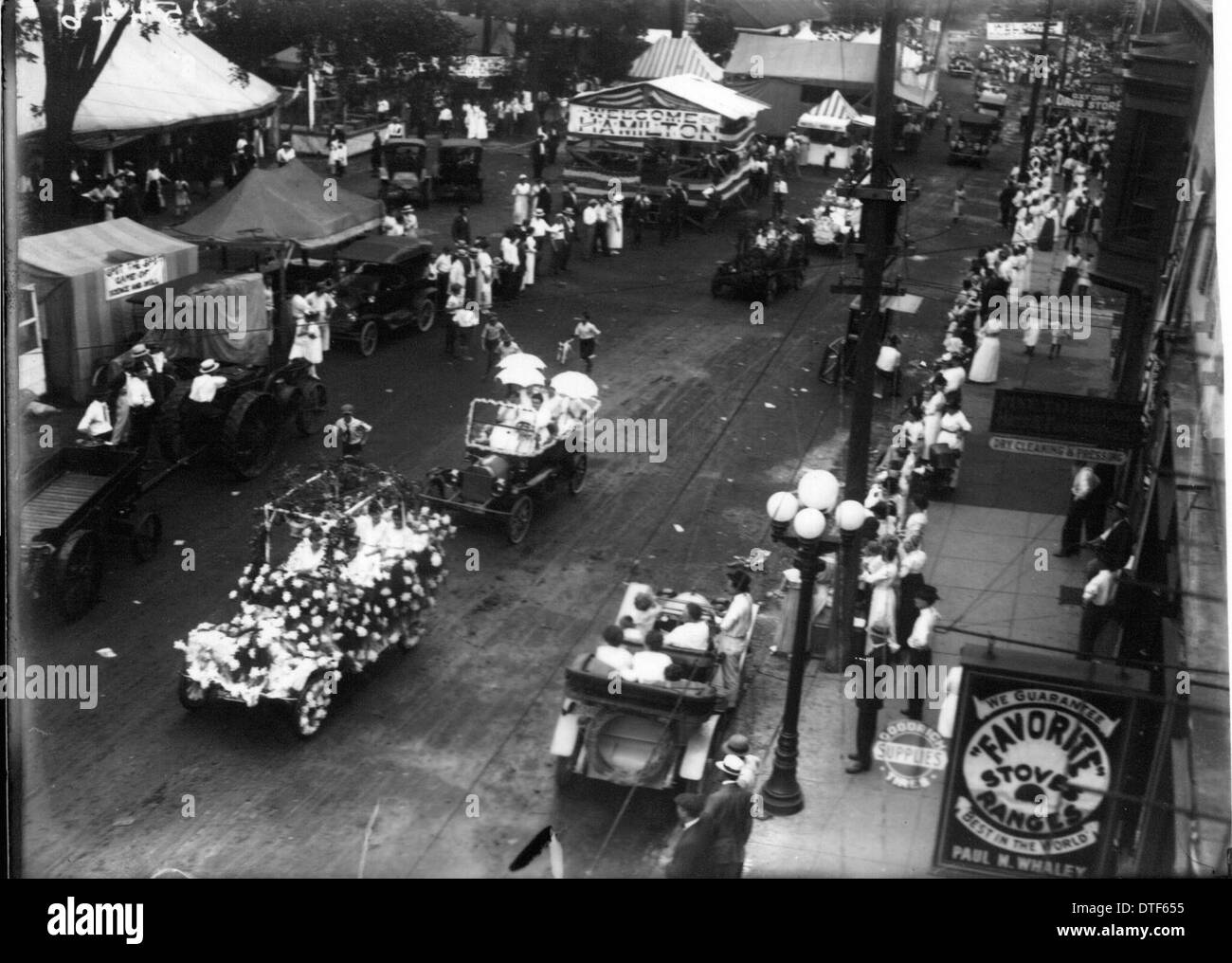 This 1915 photograph captures a procession of decorated cars at the ...