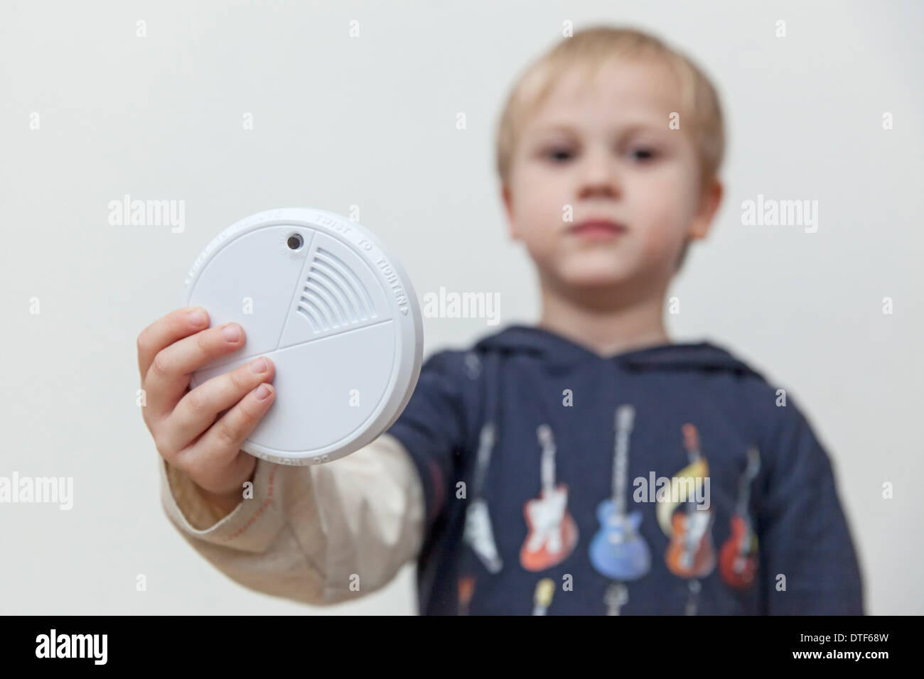 Berlin, Germany, a child shows a smoke detector Stock Photo - Alamy