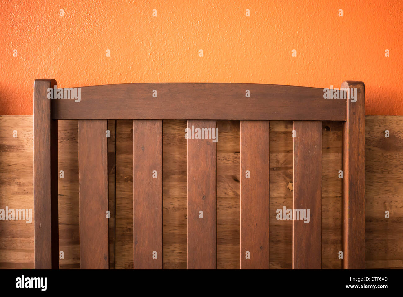 Backrest chair on the orange background in café Stock Photo - Alamy