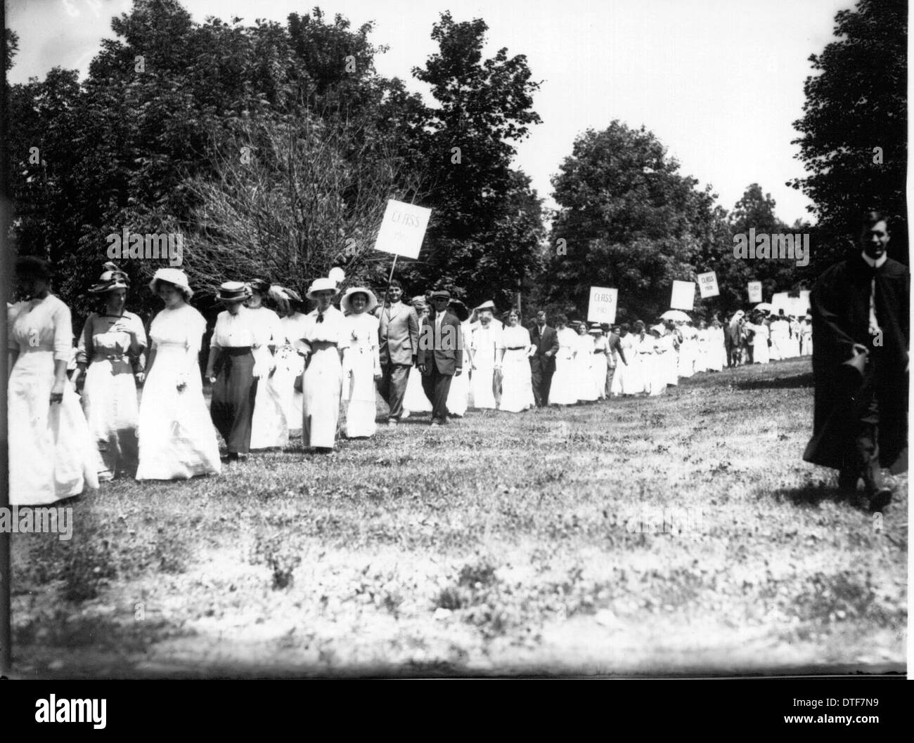A 1913 photograph shows Miami University alumni marching in procession ...