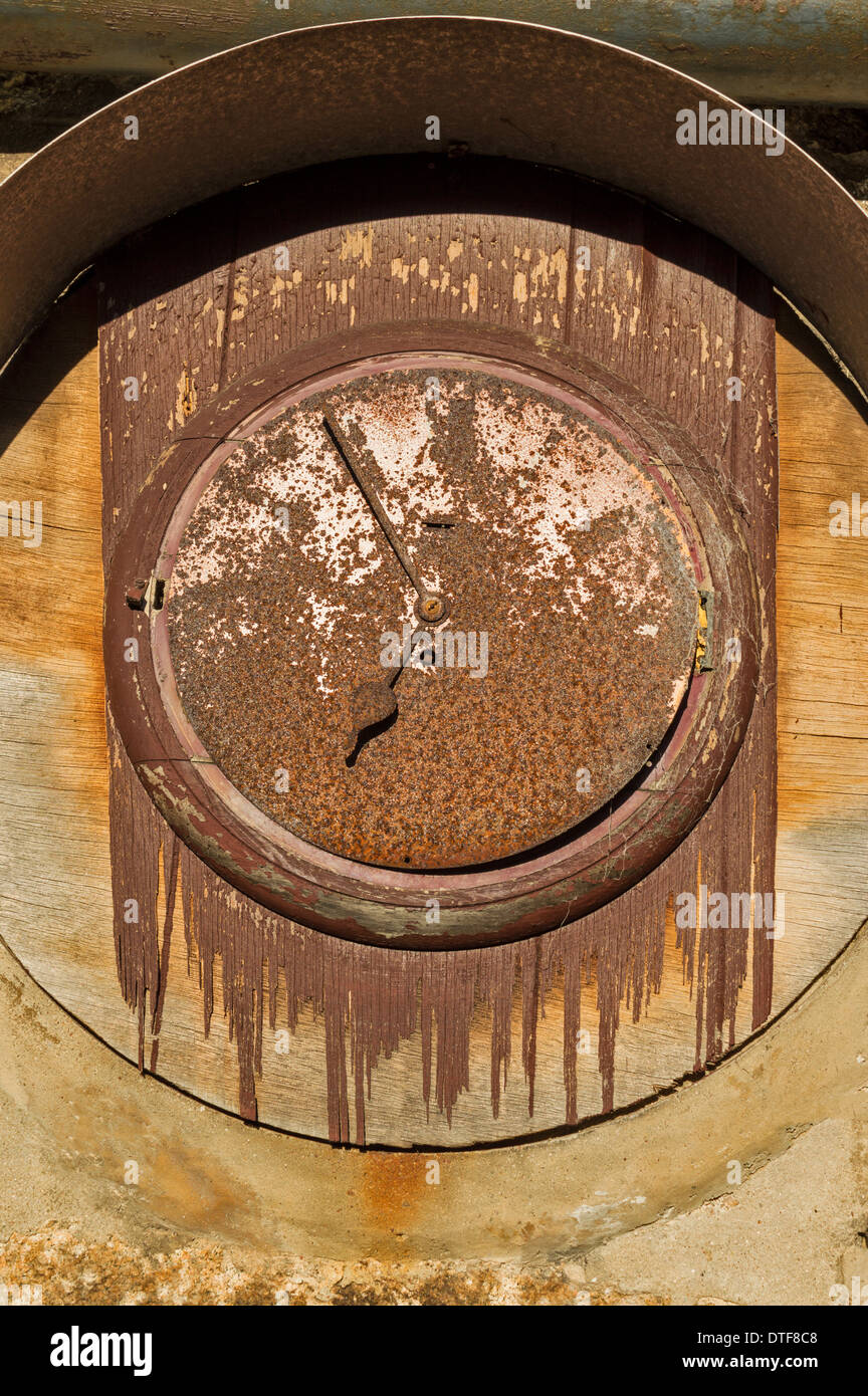 LARGE RUSTED FORGOTTEN RAILWAY STATION CLOCK ON A WALL WITH ITS TIME ...