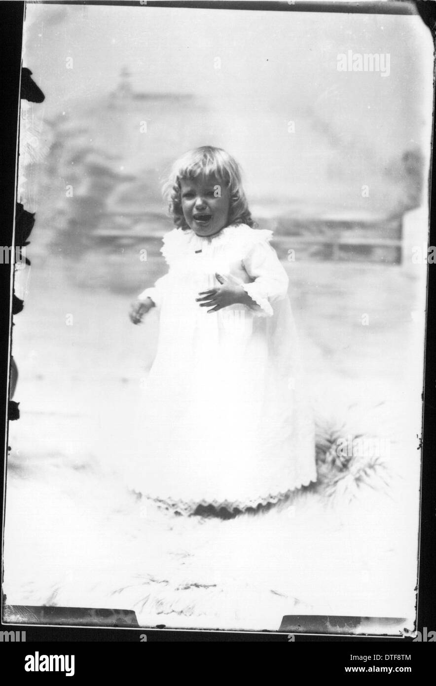 This portrait captures a crying child, representing the innocence and ...