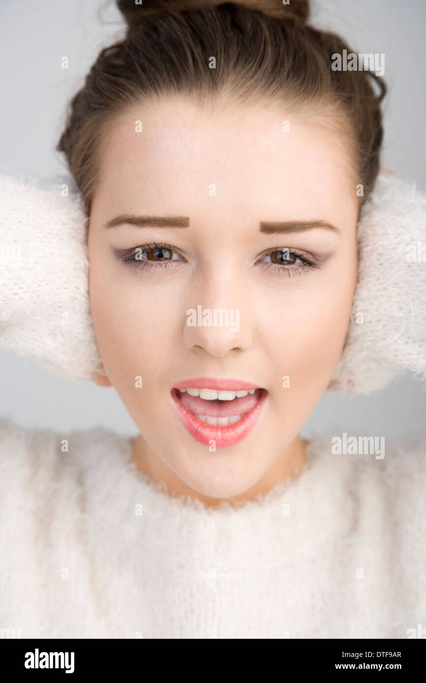 Young woman with hands over ears hi-res stock photography and images ...