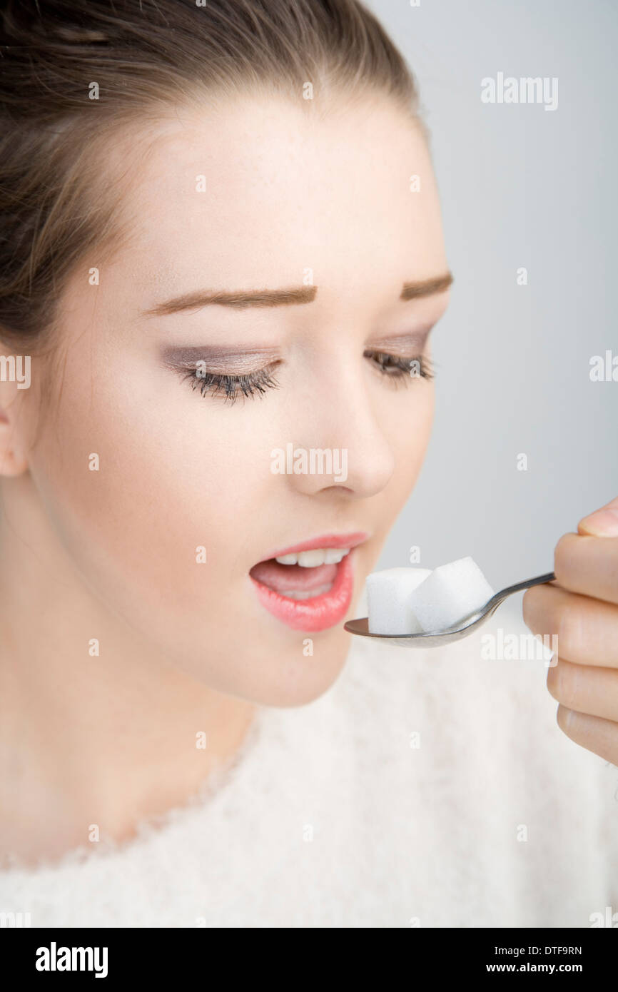 Sugar cubes eat High Resolution Stock Photography and Images - Alamy