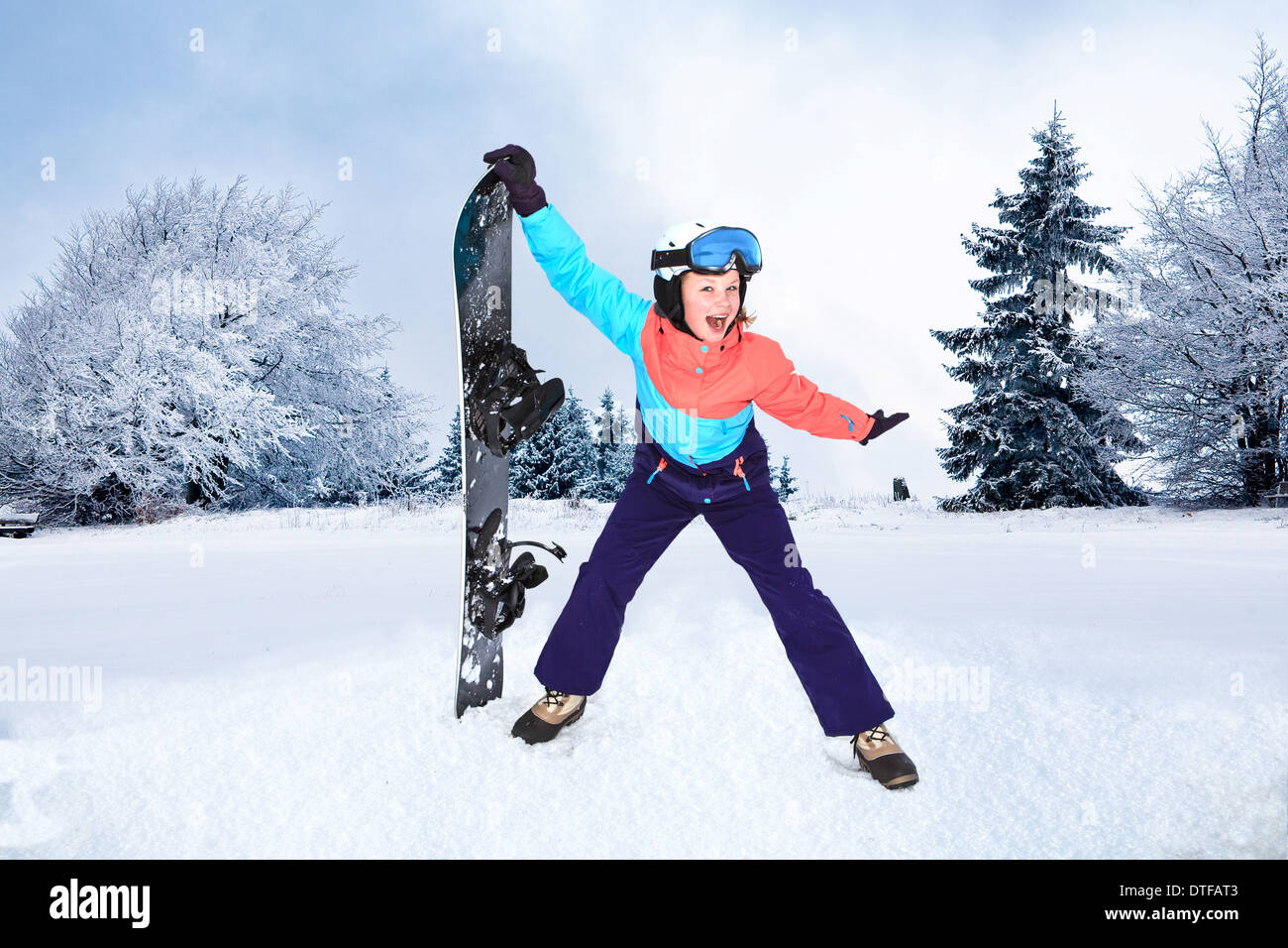 a teenage girl snowboarding in the Alps Stock Photo - Alamy