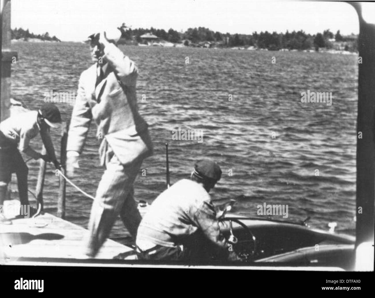 Man stepping off boat Black and White Stock Photos & Images - Alamy