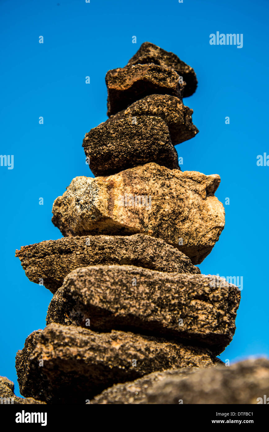 Stone heap and blue sky on the mountain in Thailand Stock Photo - Alamy