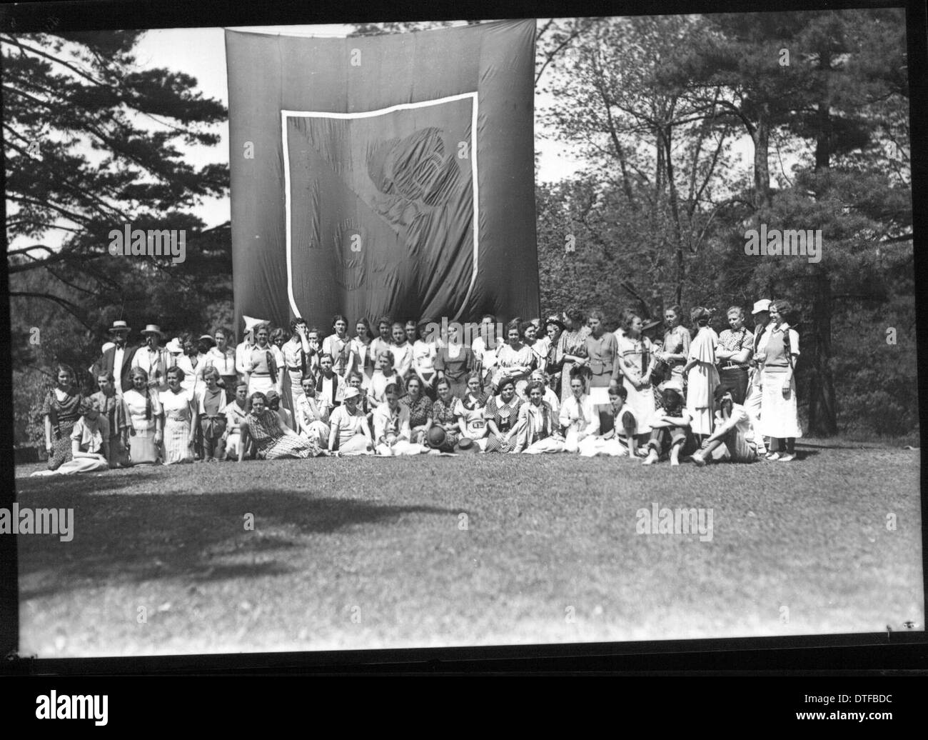This historical photograph from 1934 depicts a group portrait taken ...