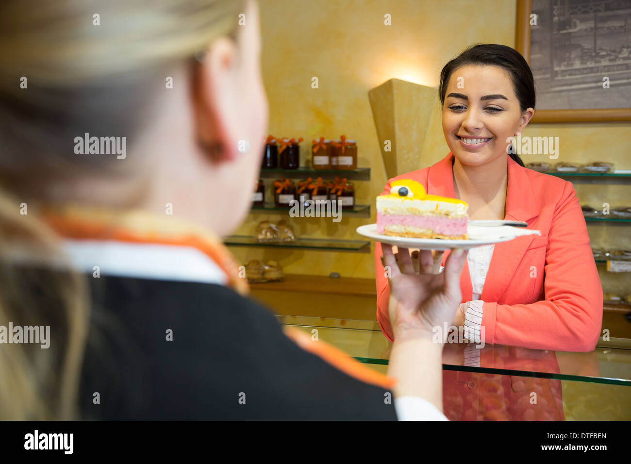 Woman serving cake cafe hi-res stock photography and images - Alamy