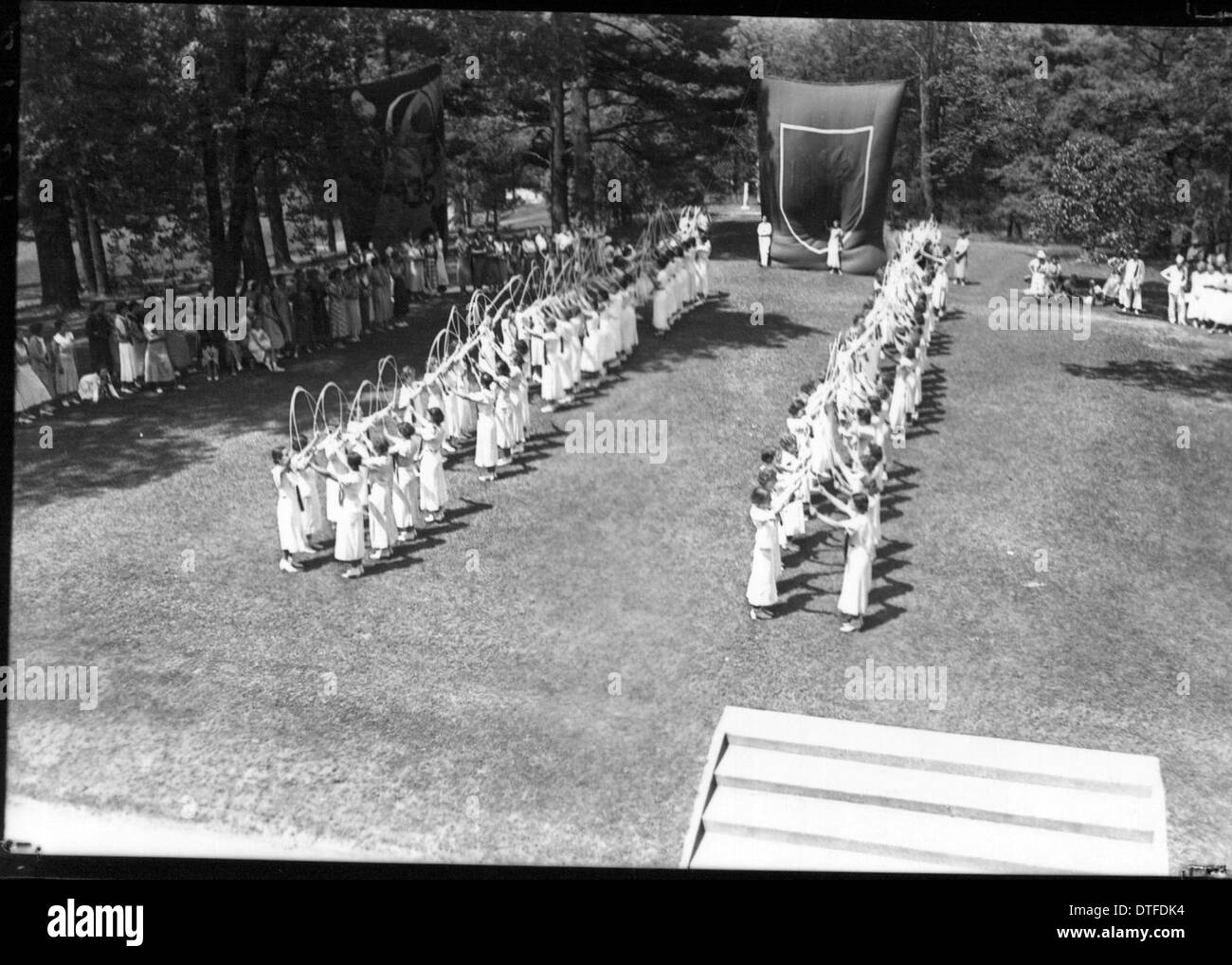 A historical photograph from 1934 shows an open-air theatrical ...