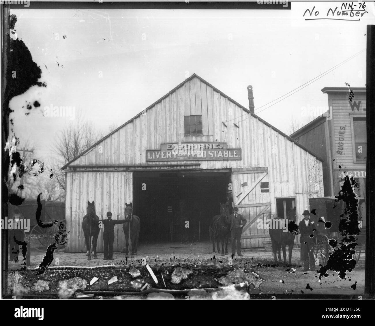 The image showcases E. Bourne's Livery Stable, depicting a historic ...