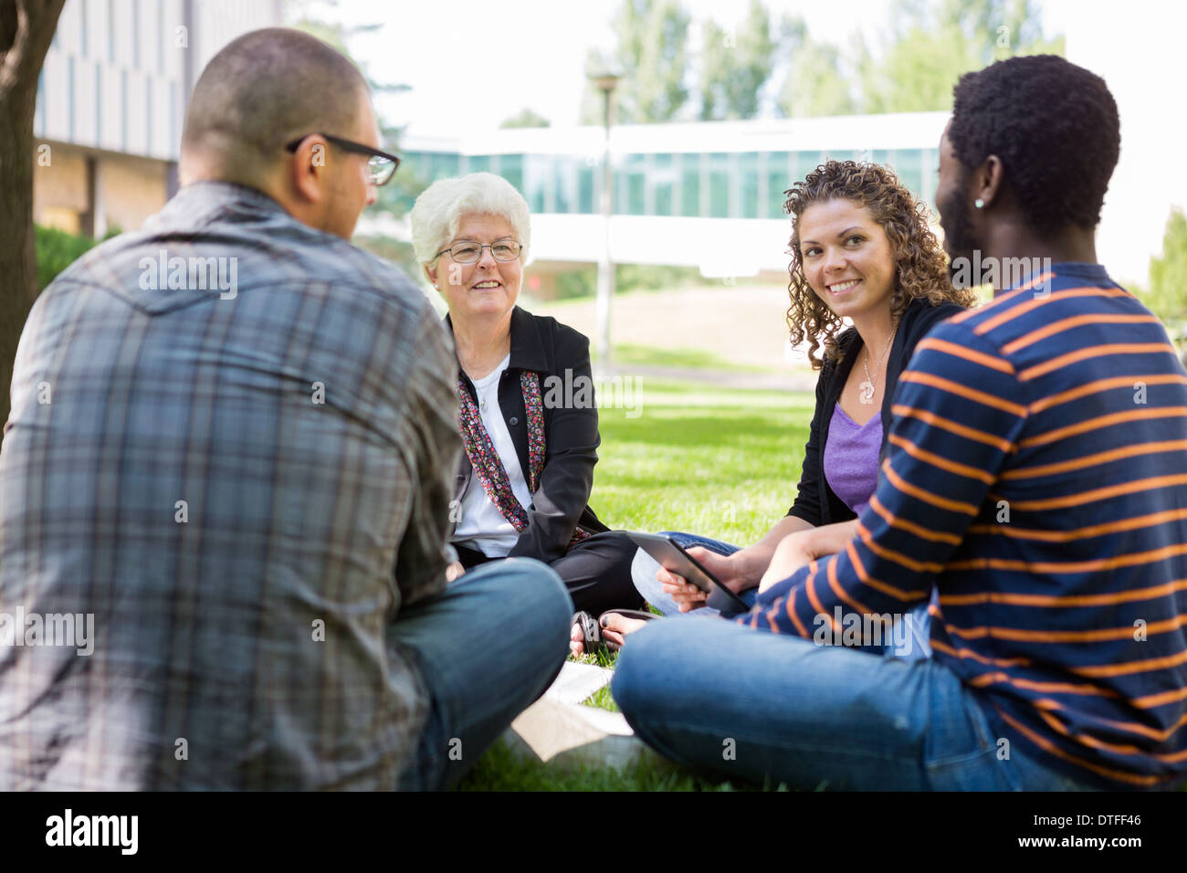 University Professor Helping Students Outdoors Stock Photo - Alamy