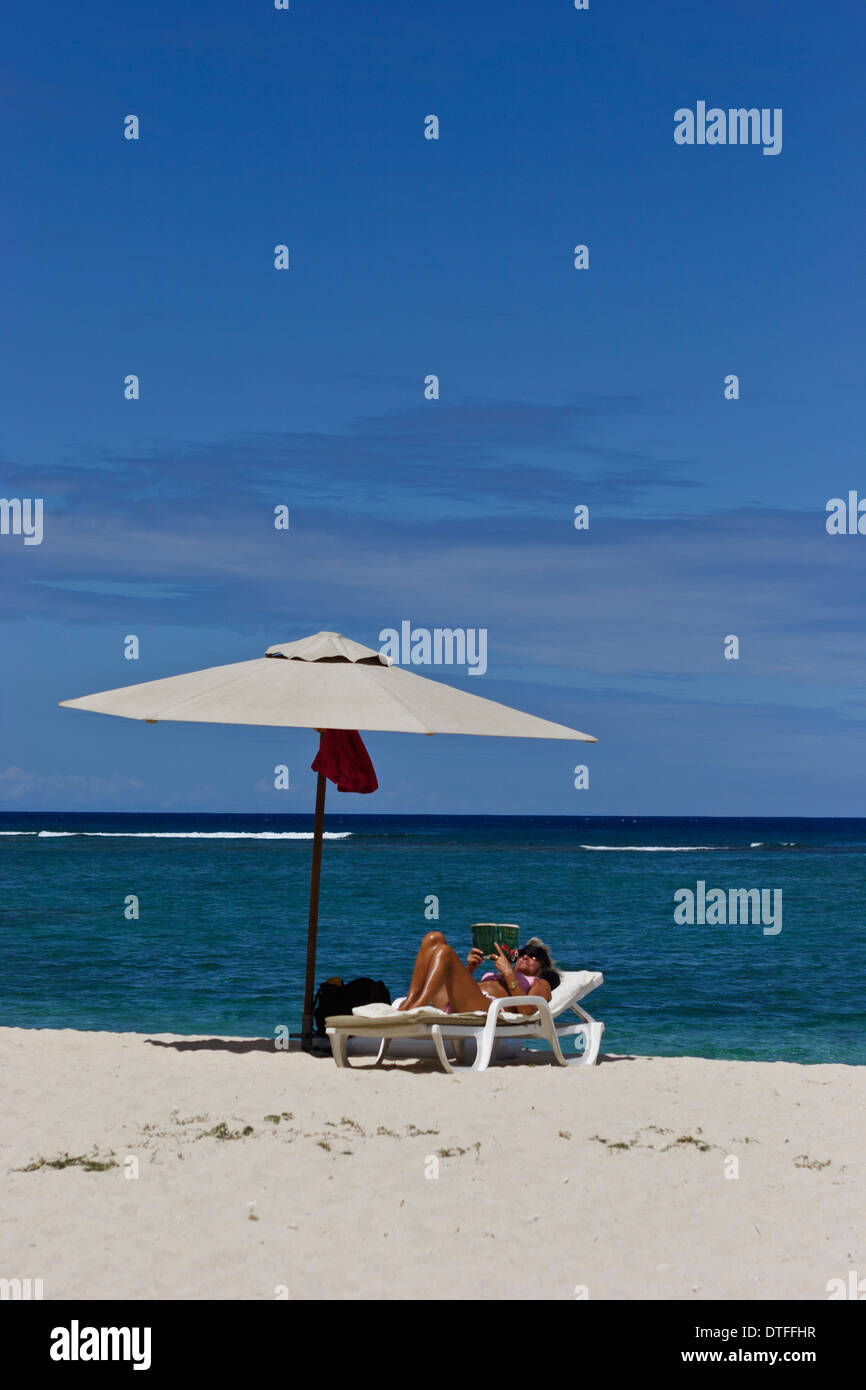 Sunbathing on a sandy beach, Mauritius Stock Photo - Alamy