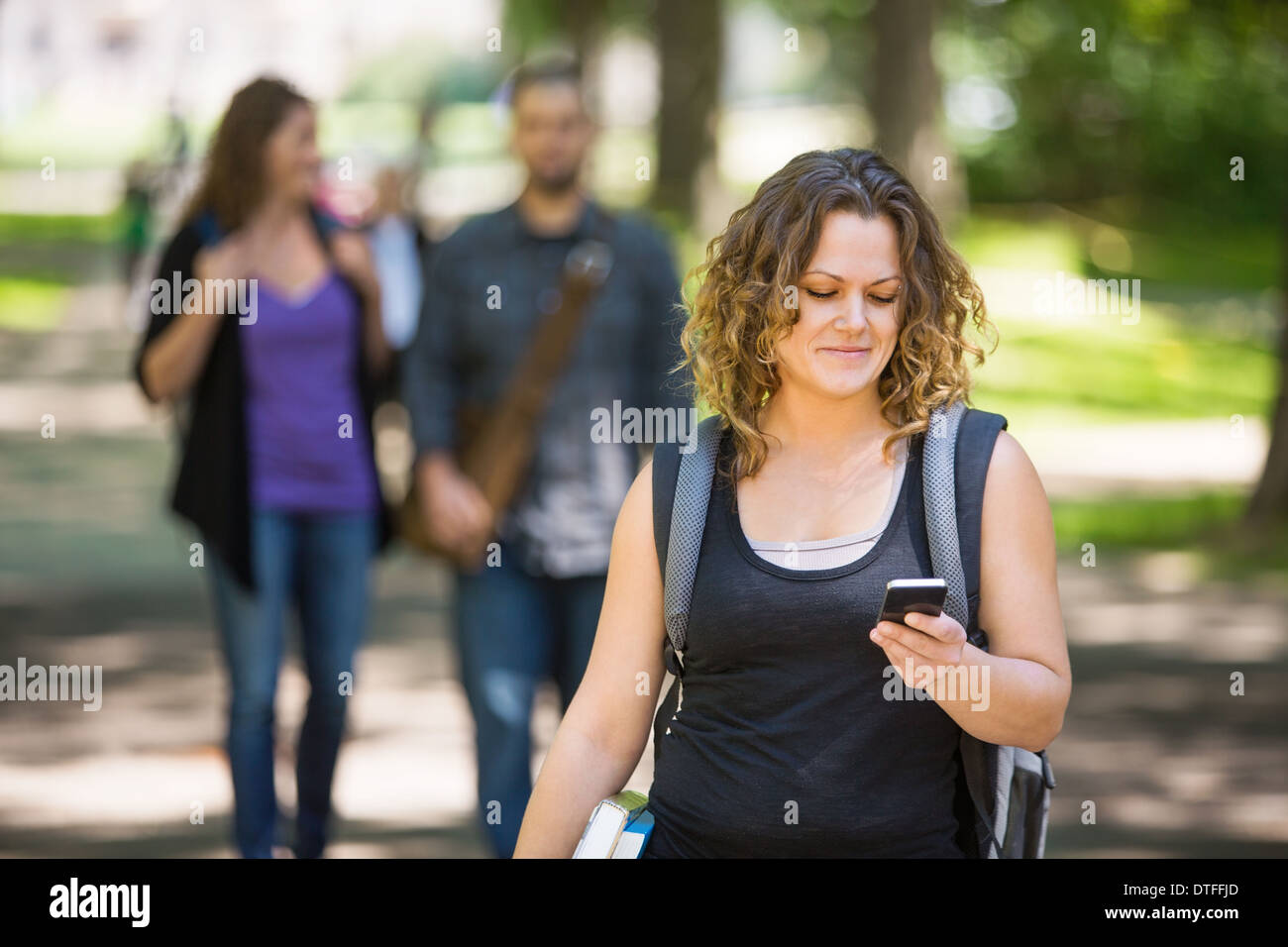 Female Student Using Cellphone On Campus Stock Photo - Alamy