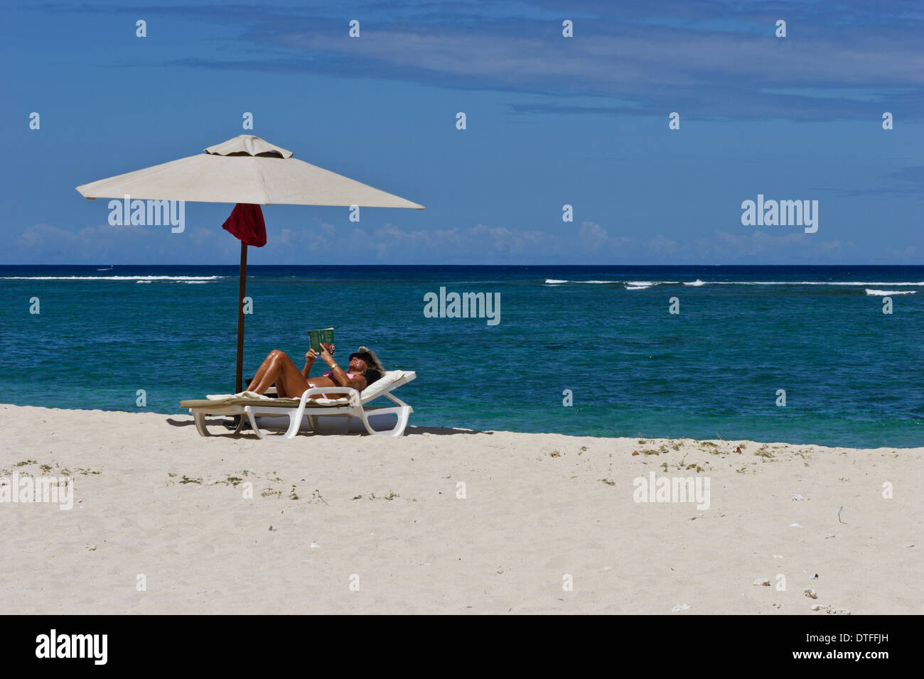 Sunbathing on a sandy beach, Mauritius Stock Photo - Alamy